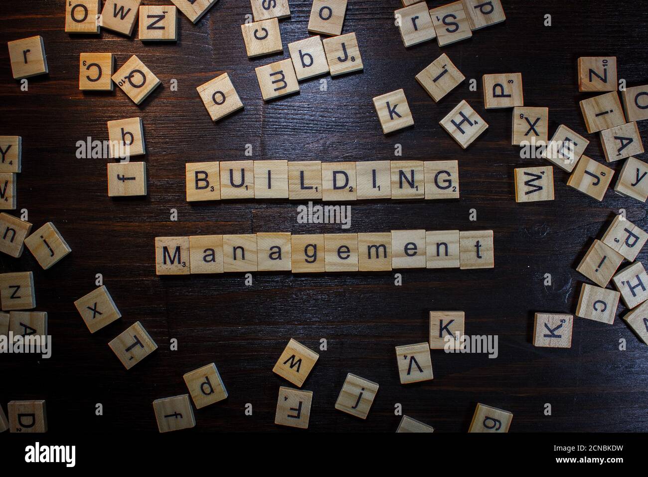 Word or phrase Building Management made with scrabble letters on black ...