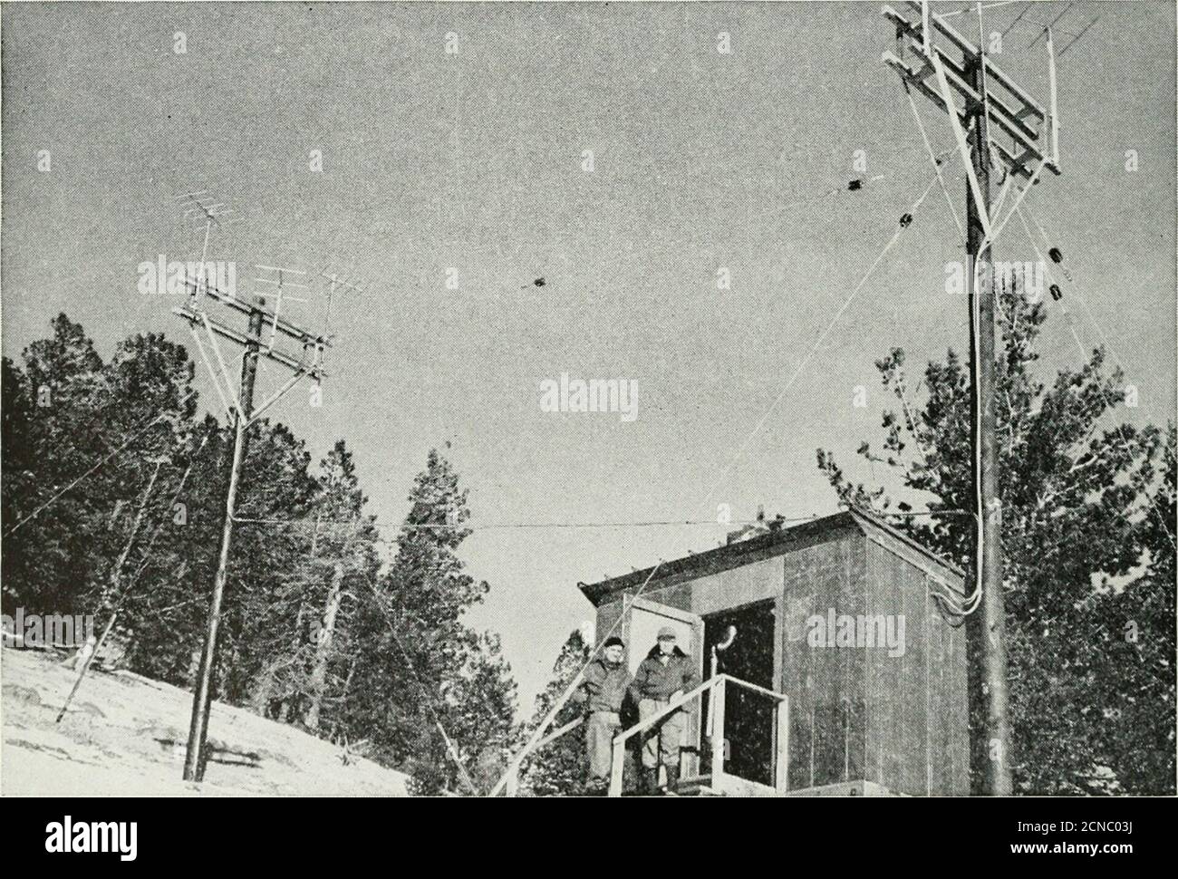 . Bell telephone magazine . Erecting the antennas Jor the ...