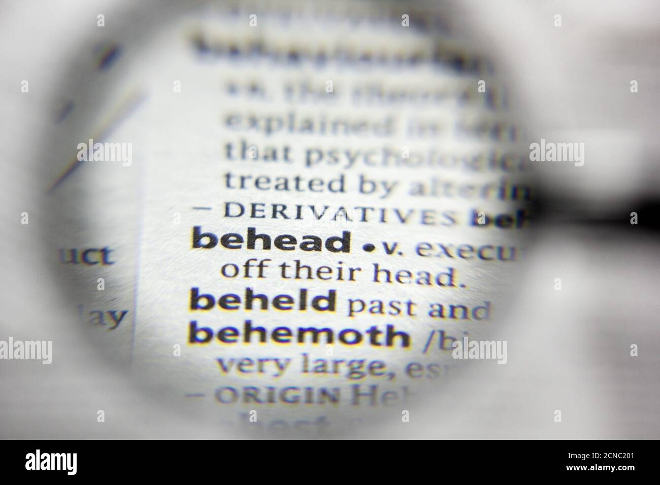 The word or phrase behead in a dictionary Stock Photo - Alamy