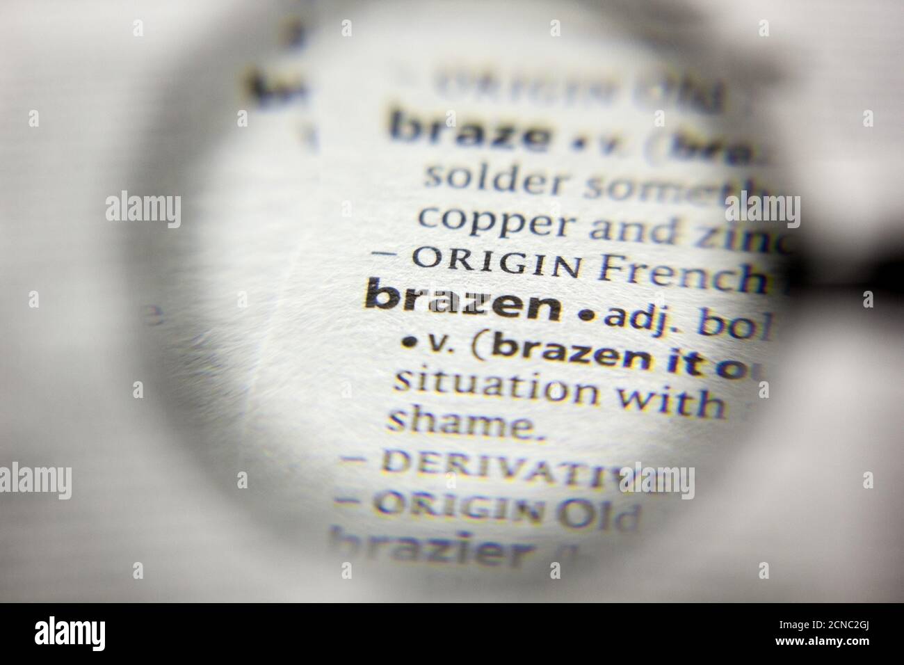 The word or phrase Brazen in a dictionary Stock Photo - Alamy