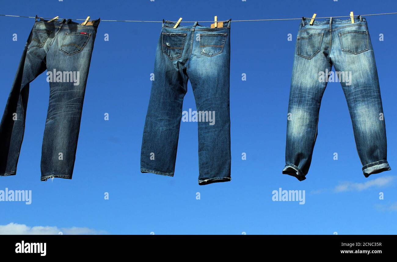Jeans (blue) hanging on a rope with clothespins pegs, Illustration ...