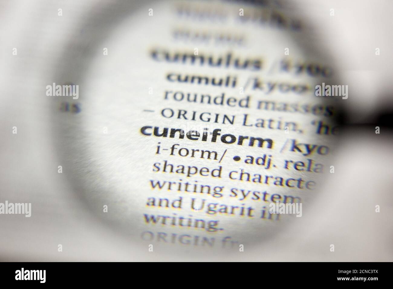 The word or phrase Cuneiform in a dictionary Stock Photo - Alamy