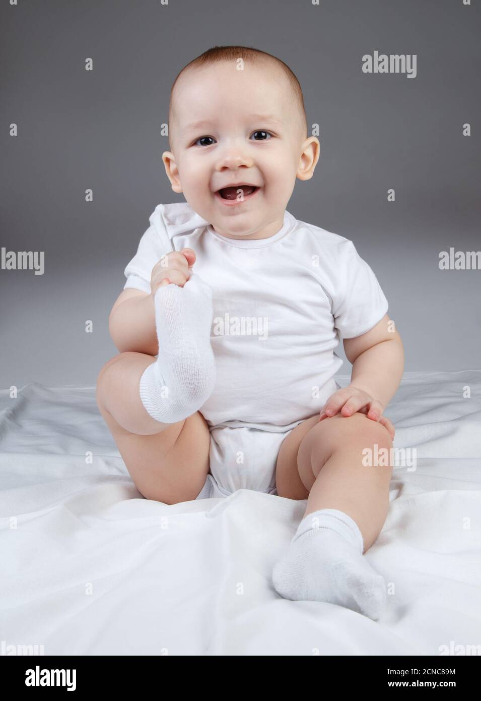Picture of a ten-month-old baby on a white background Stock Photo - Alamy