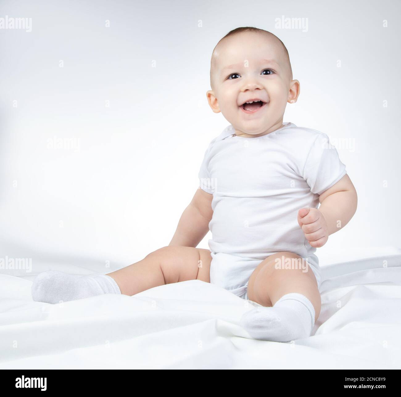 Photo of a ten-month-old smiling baby looking up Stock Photo - Alamy