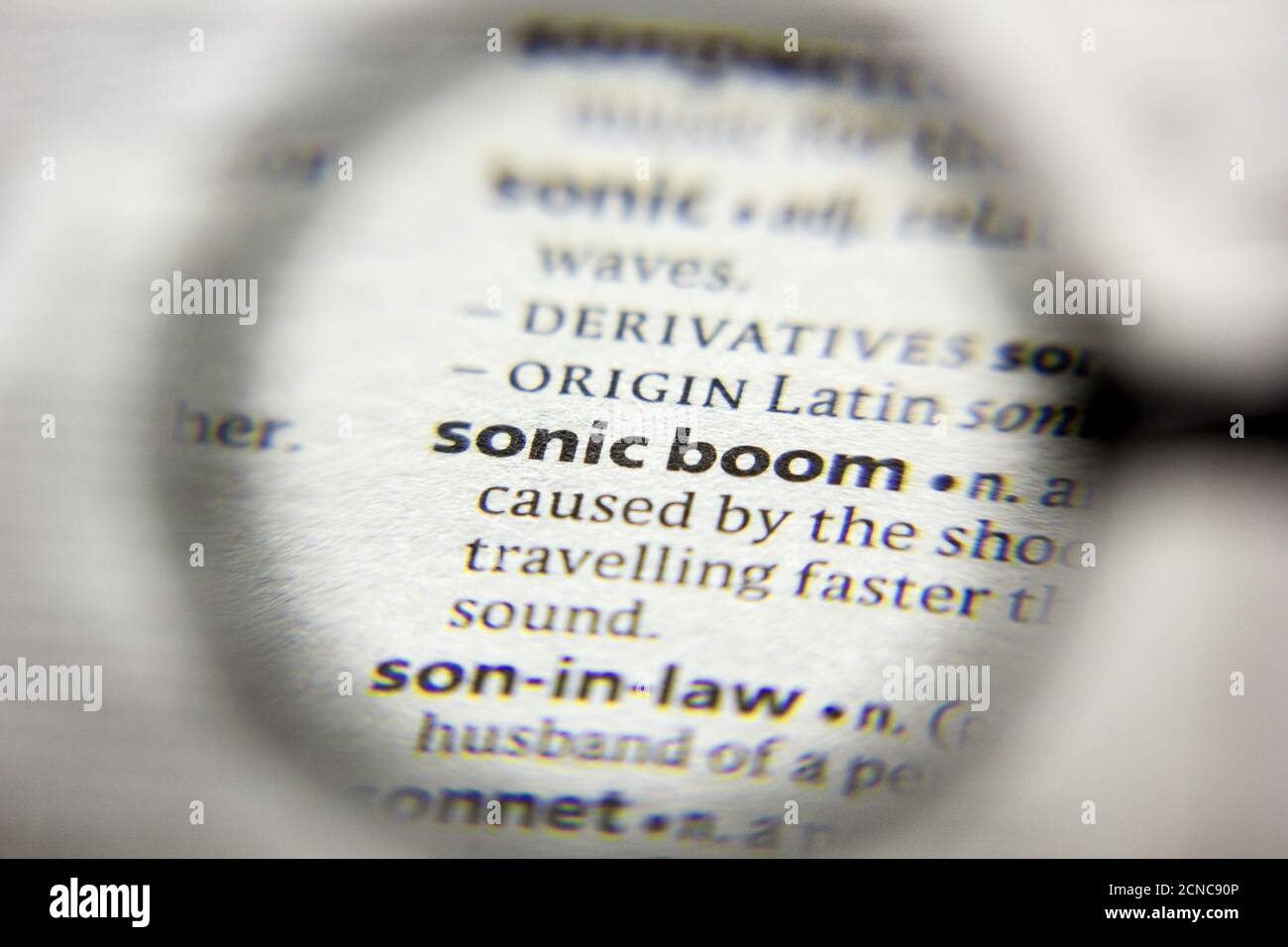 The word or phrase Sonic boom in a dictionary Stock Photo - Alamy