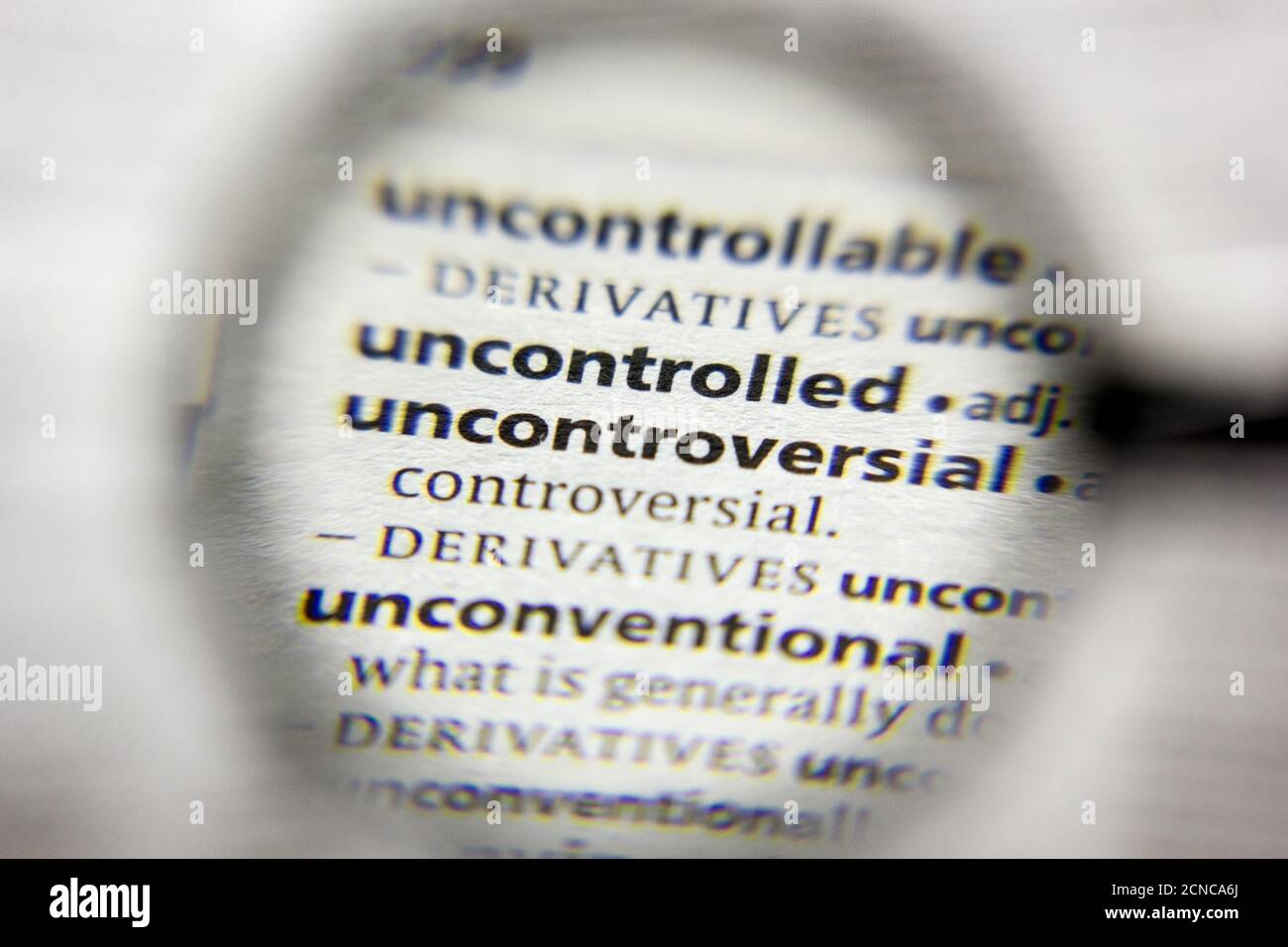 The word or phrase Uncontroversial in a dictionary Stock Photo - Alamy