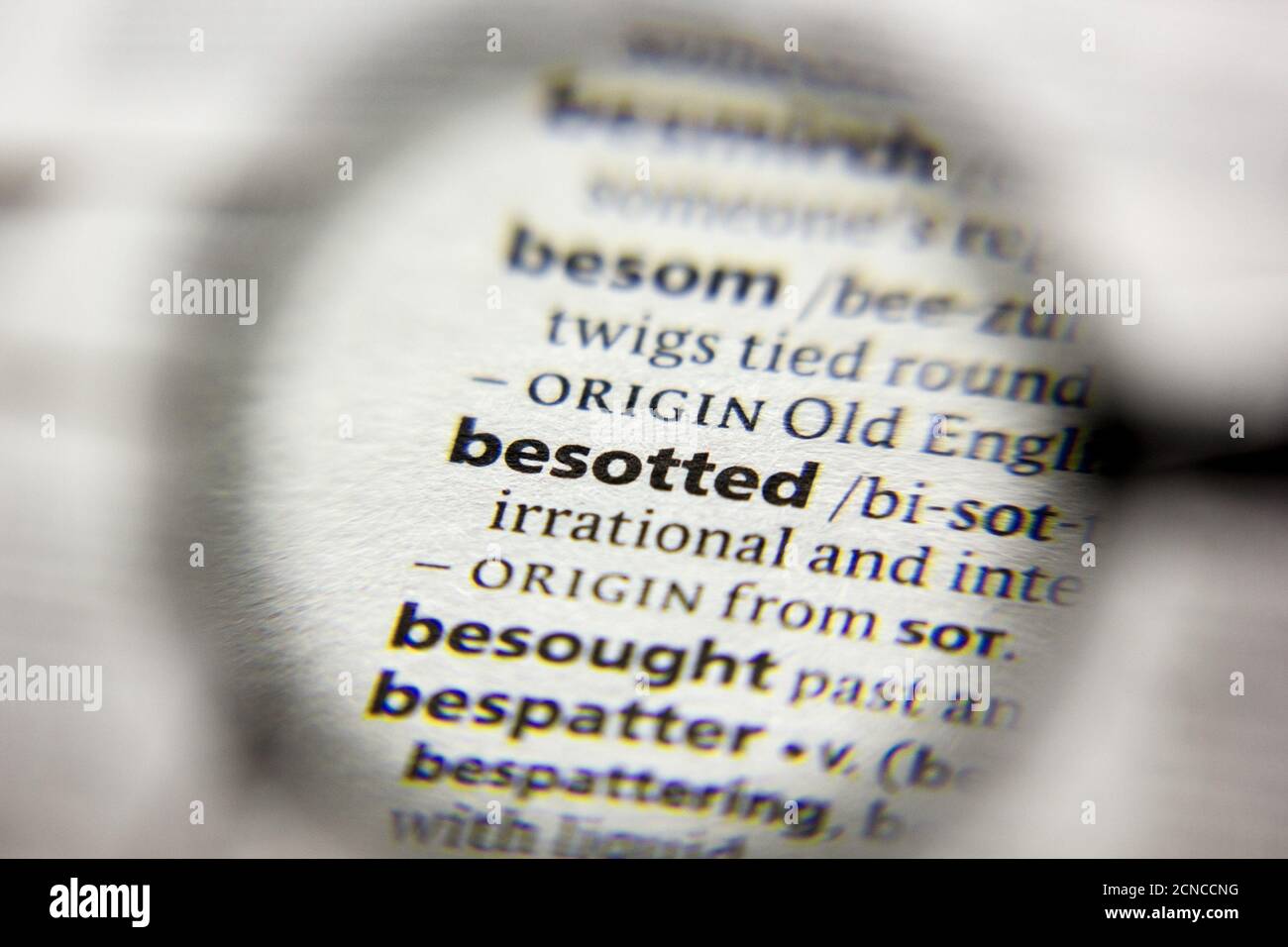 The word or phrase Besotted in a dictionary Stock Photo - Alamy