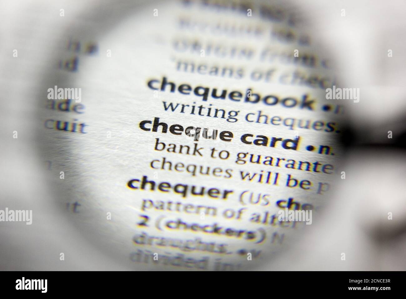 The word or phrase Cheque card in a dictionary Stock Photo - Alamy