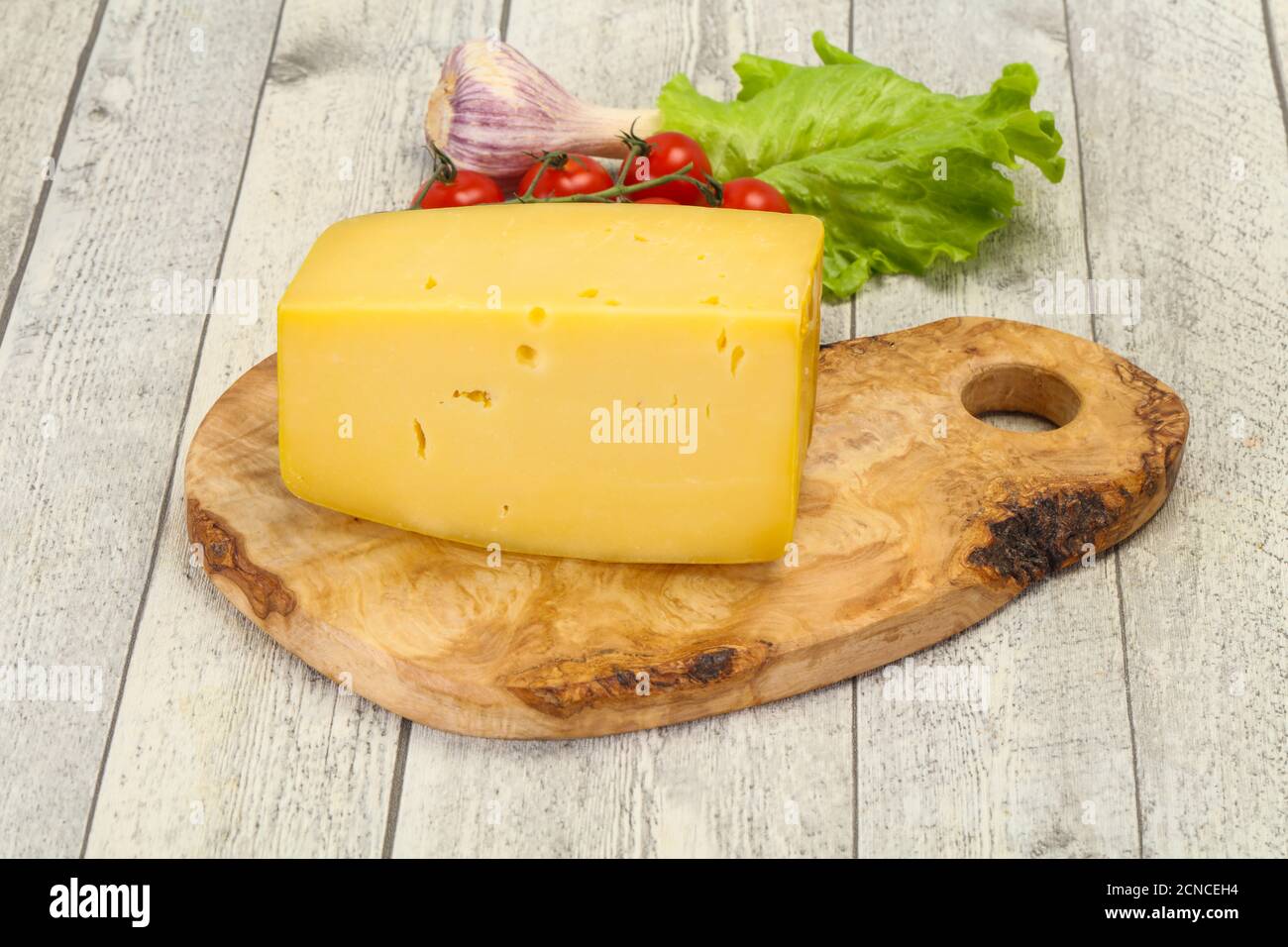 Swiss Hard yellow tasty cheese brick Stock Photo - Alamy