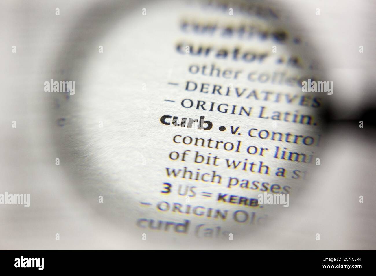 The word or phrase Curb in a dictionary Stock Photo - Alamy