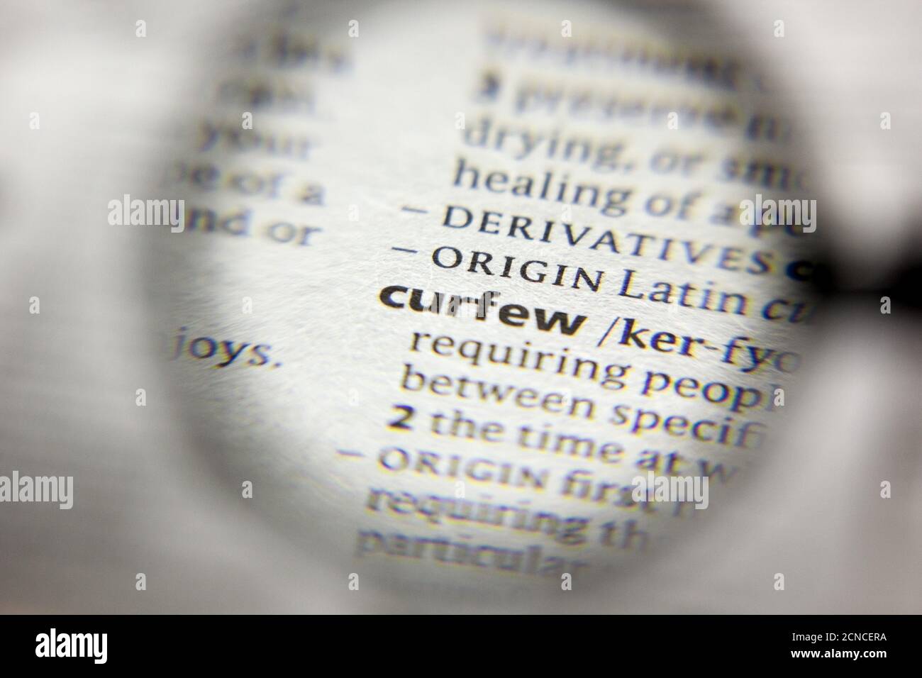 The word or phrase Curfew in a dictionary Stock Photo - Alamy