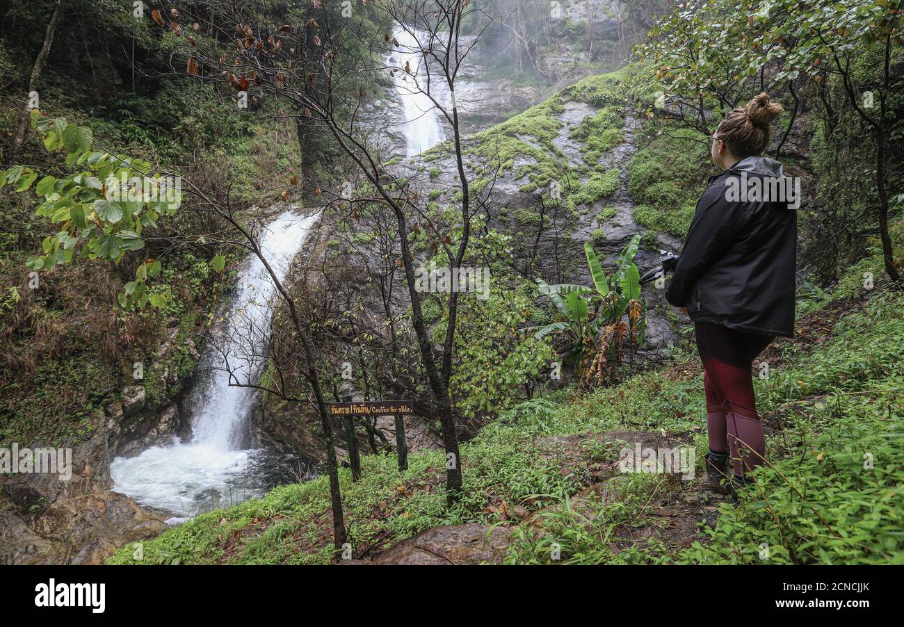 DOI INTHANON NATIONAL PARK, TAIWAN - Sep 03, 2019: A female hiker takes ...