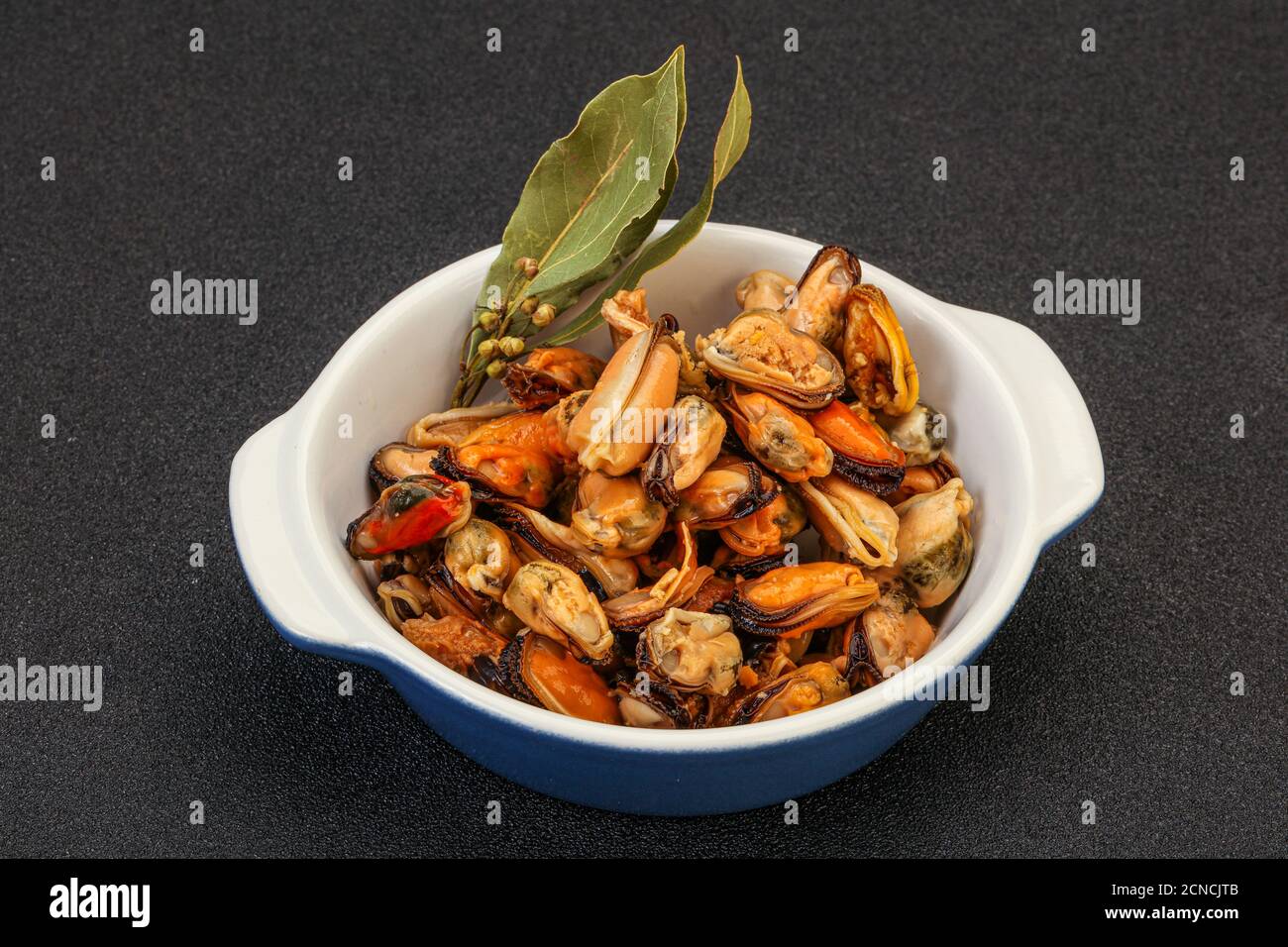 Pickled mussels with spices in the bowl Stock Photo - Alamy