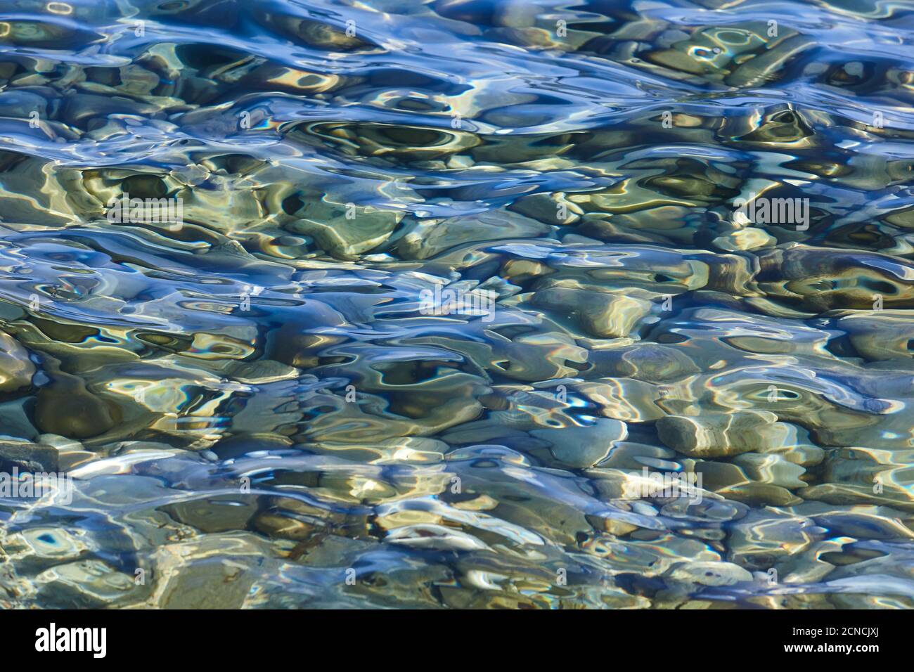 Pebble stone reflections on the water. Nature background. Zen ...