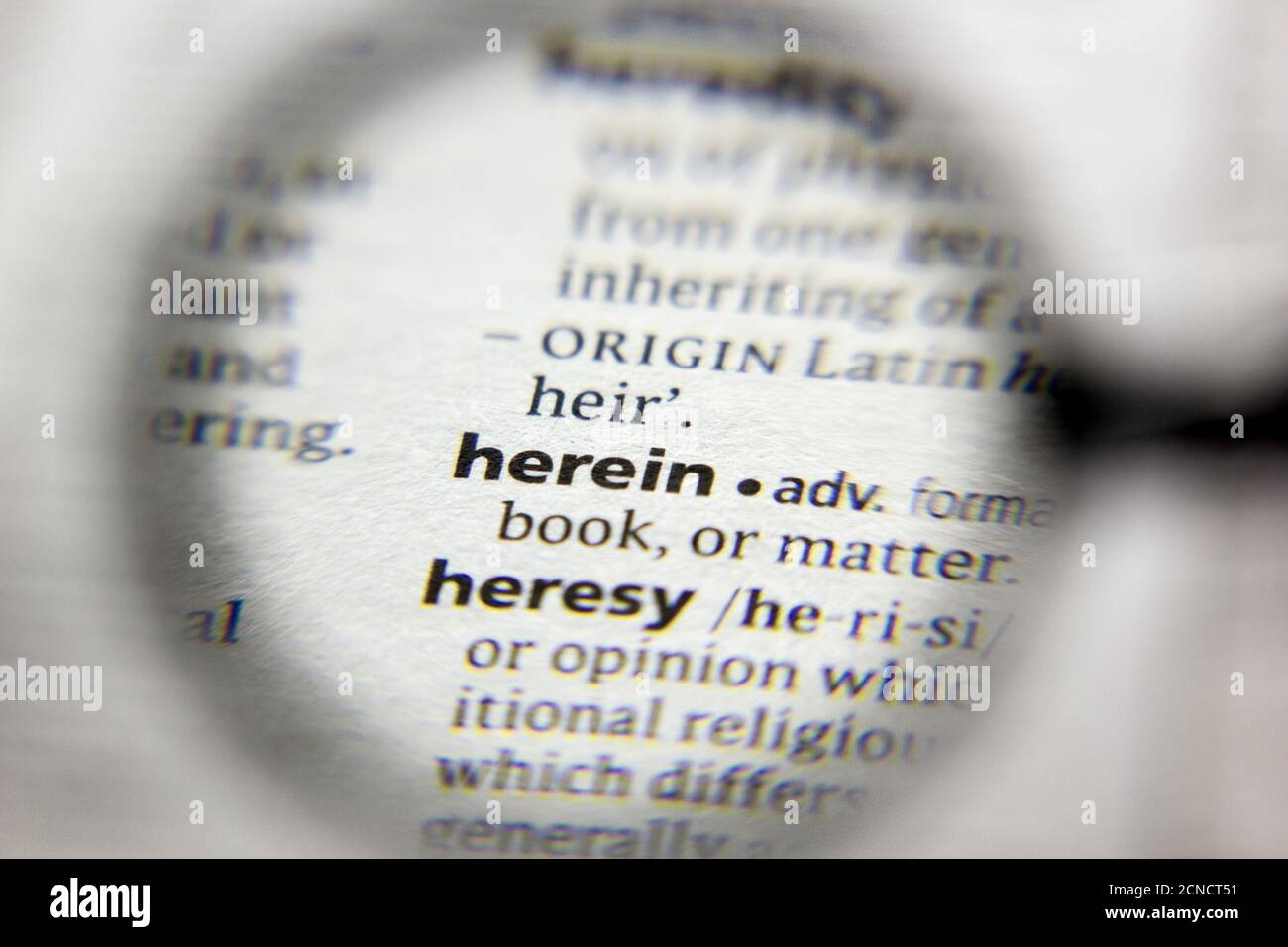 The word or phrase Herein in a dictionary Stock Photo - Alamy