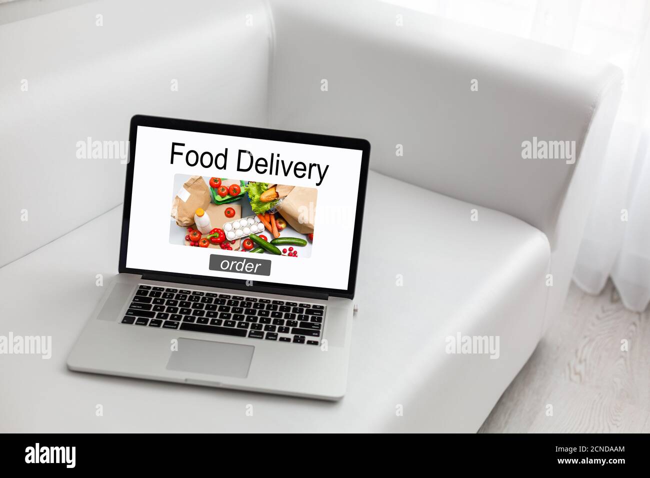 Food take away website in a laptop screen. Lunch at the office Stock ...