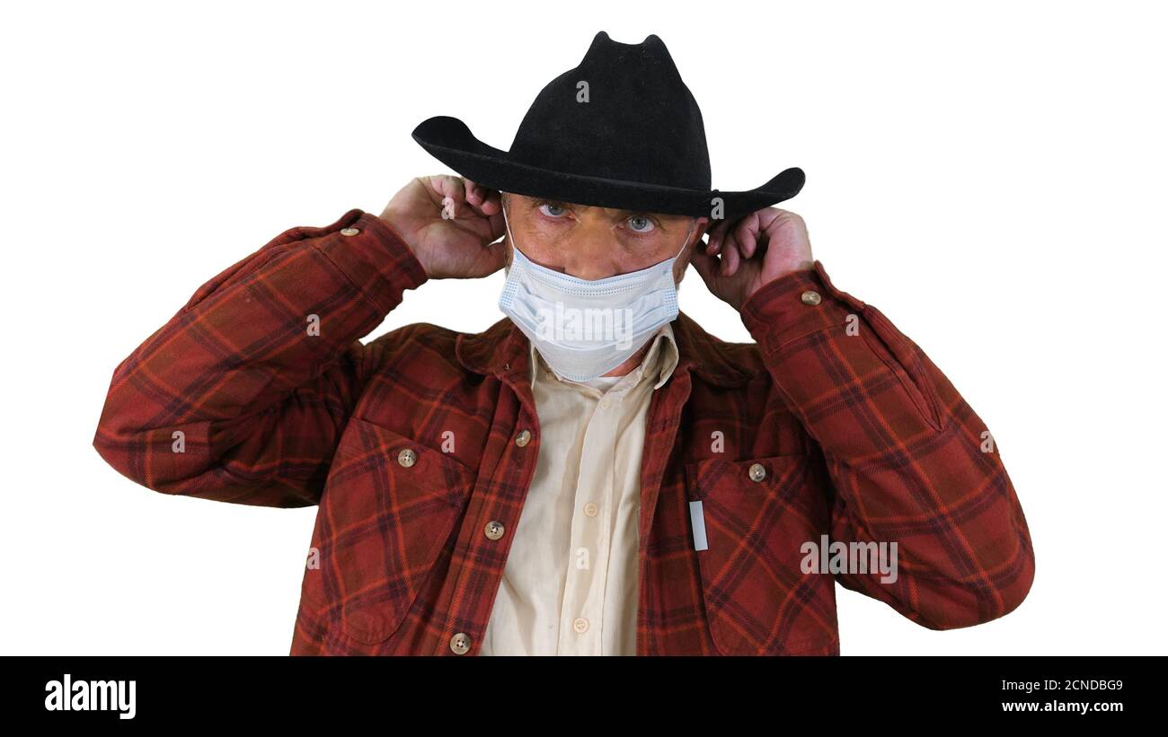 Cowboy wears medical mask to prevent corona virus on white backg Stock ...
