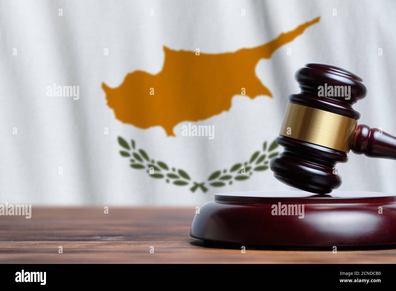 Justice and court concept in Republic of Cyprus. Judge hammer on a flag ...