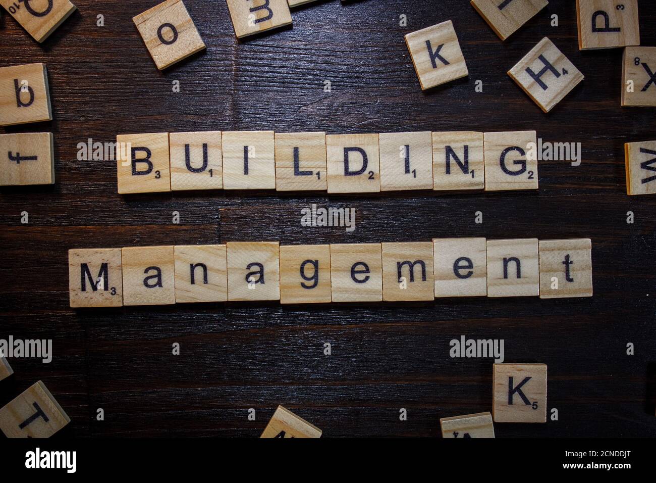 Word or phrase Building Management made with scrabble letters on black ...