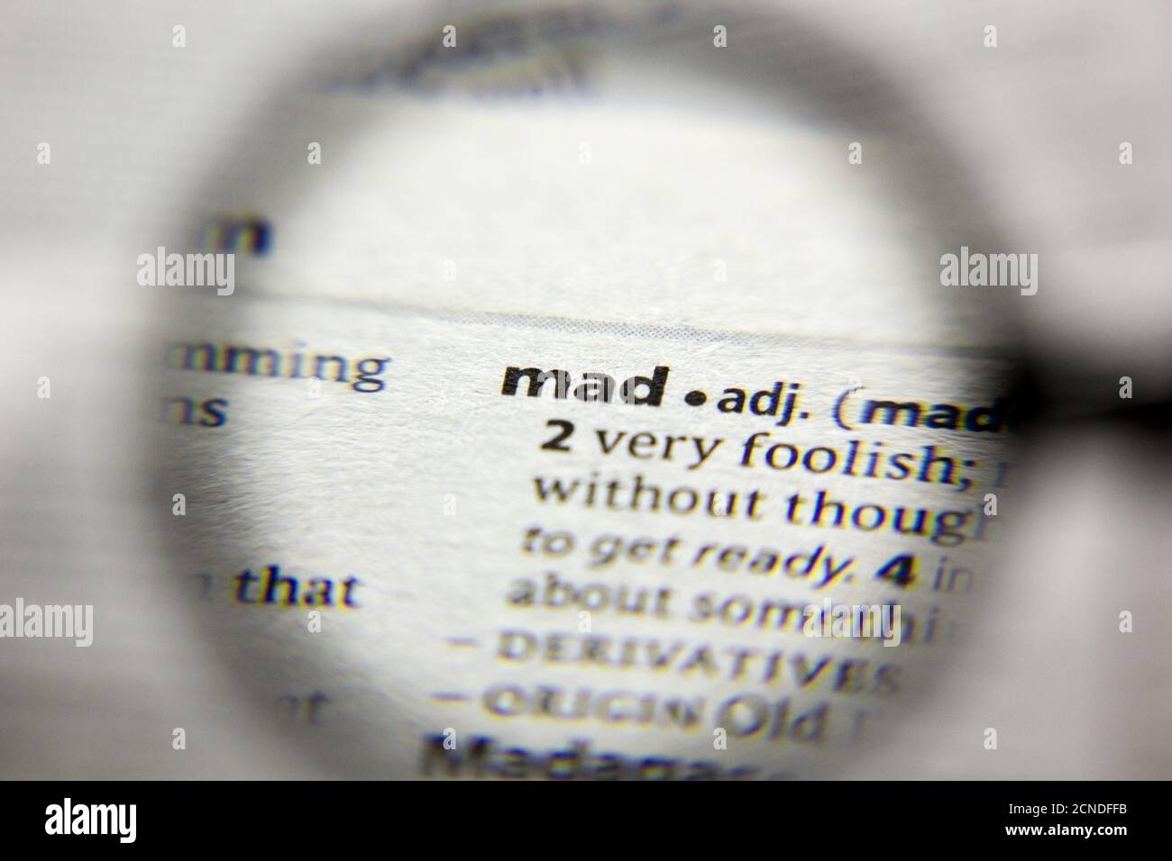The word or phrase Mad in a dictionary Stock Photo - Alamy