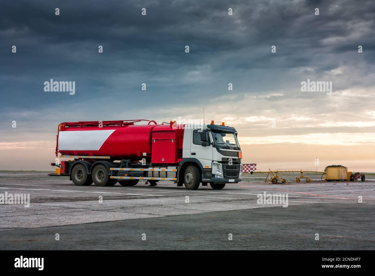 Aircraft fueler on the cloudy morning airport apron Stock Photo - Alamy