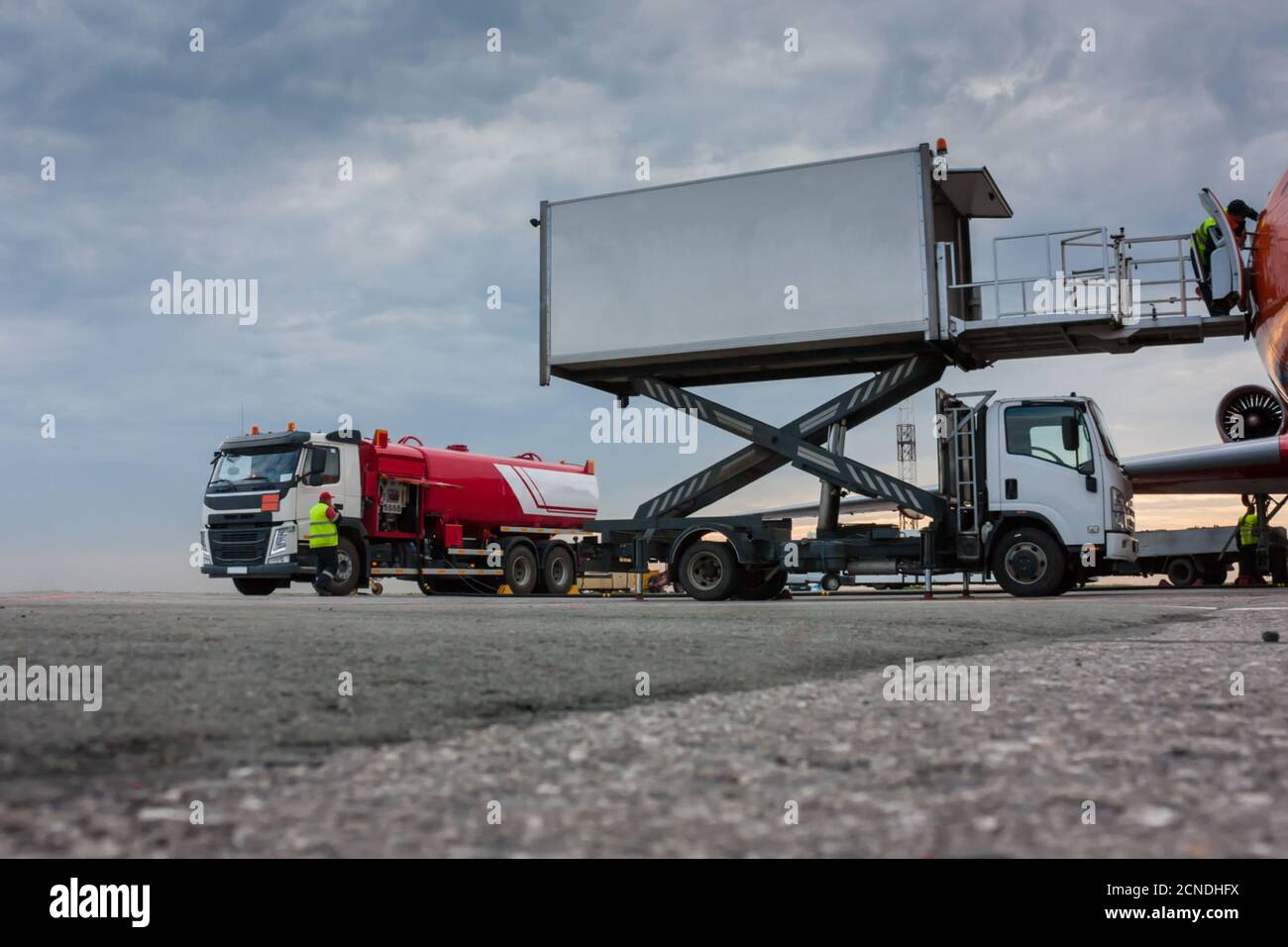 Refueling and loading food on the plane Stock Photo - Alamy