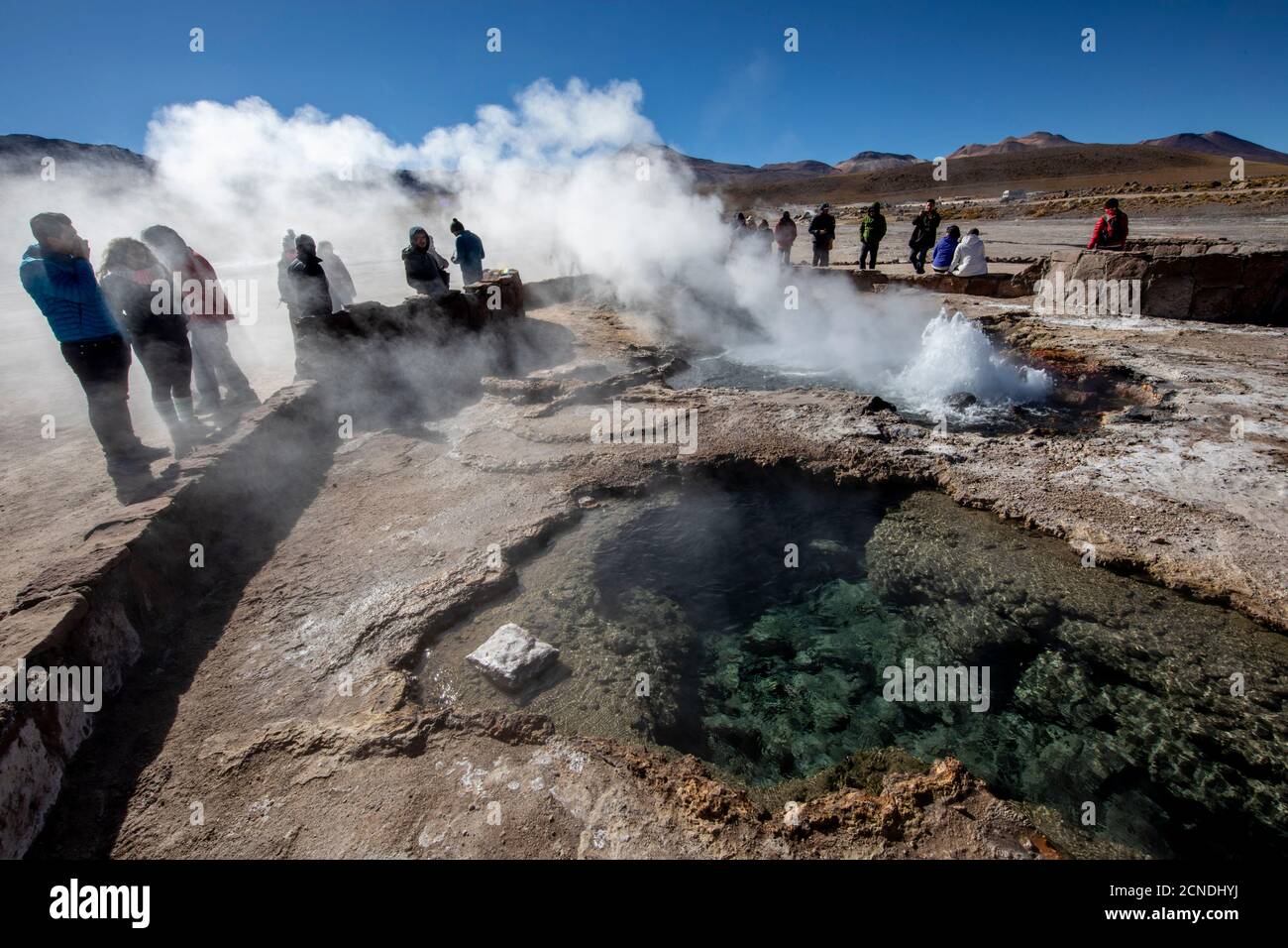 Tourists at the Geysers del Tatio (El Tatio), the third largest geyser ...
