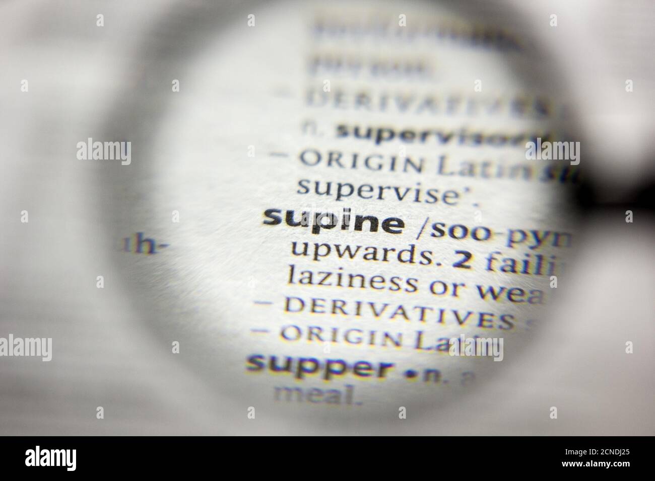 The word or phrase Supine in a dictionary Stock Photo - Alamy