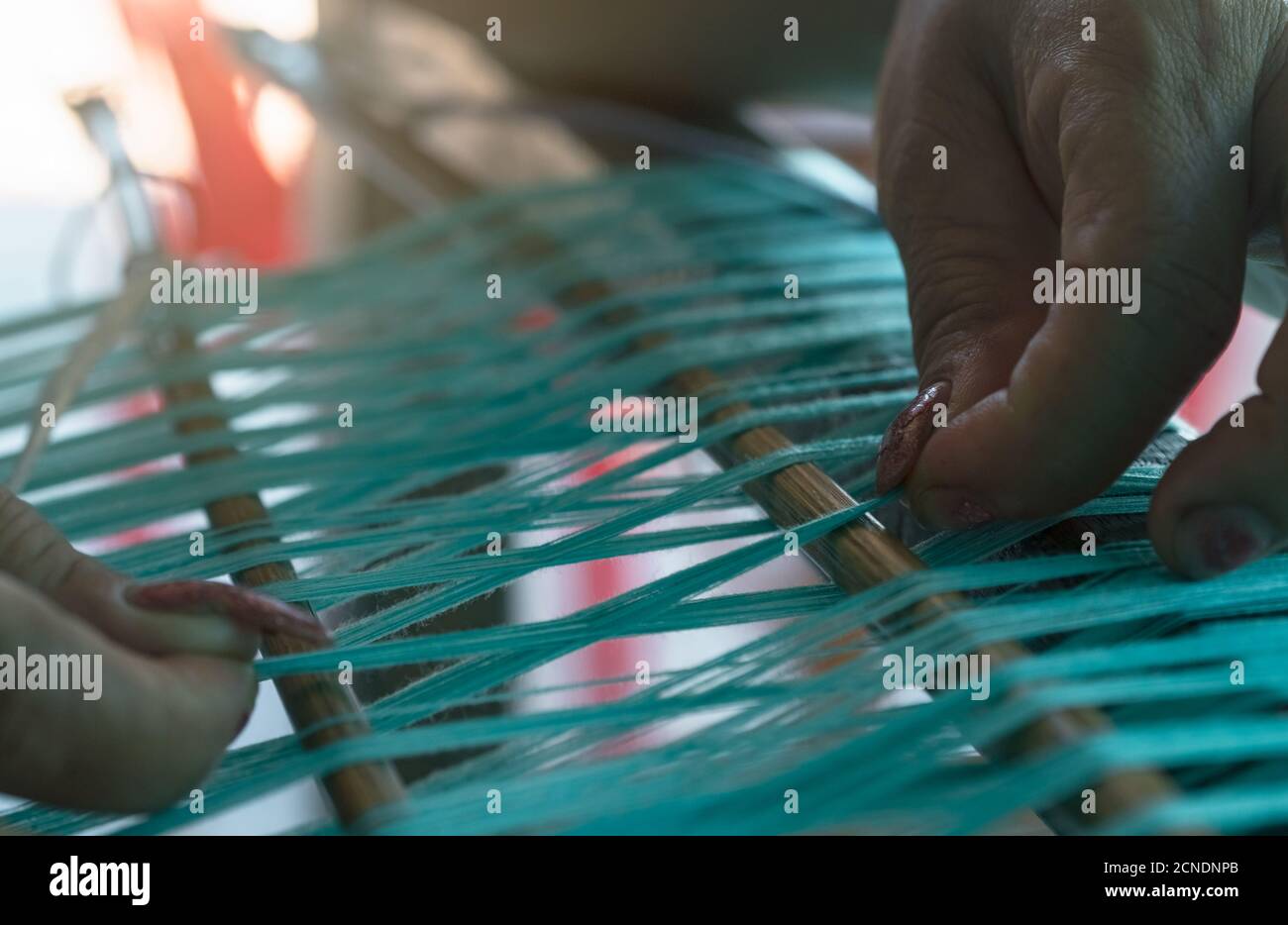 Woman working on weaving machine for weave handmade fabric. Textile ...