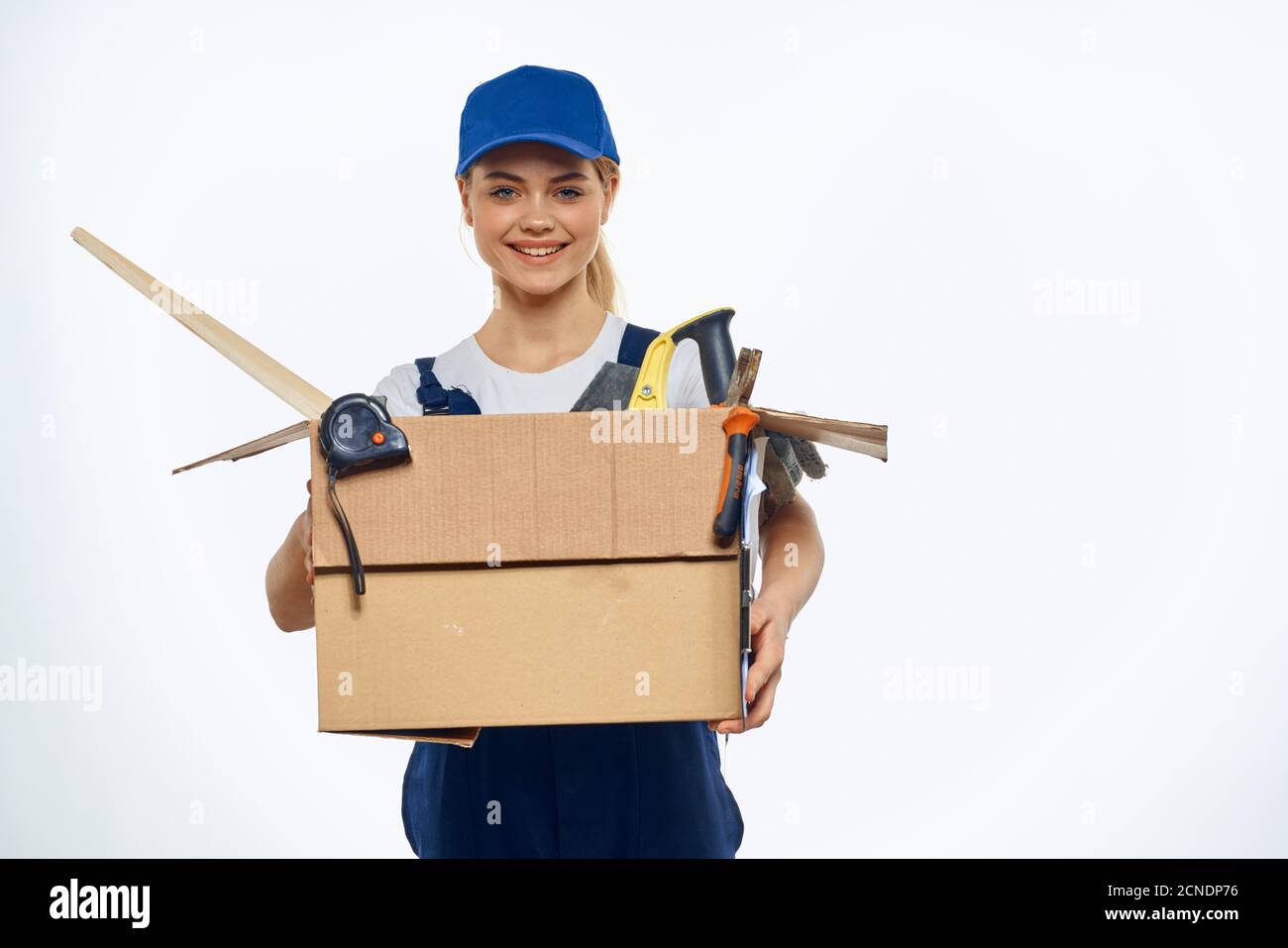 Woman working with box in hands of tools delivery service light ...