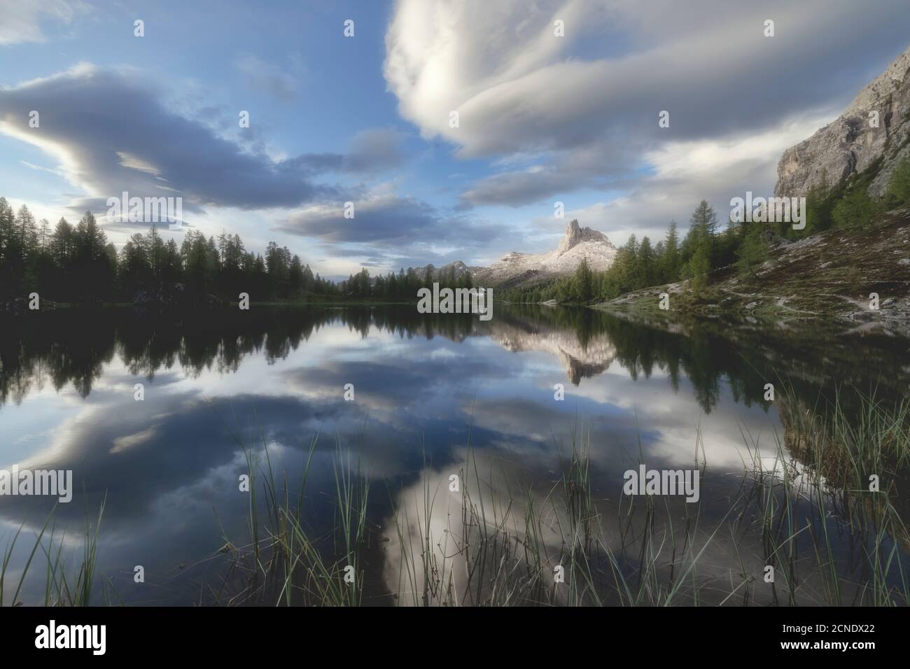 Clouds at sunrise over Rifugio Croda da Lago and Becco di Mezzodi ...