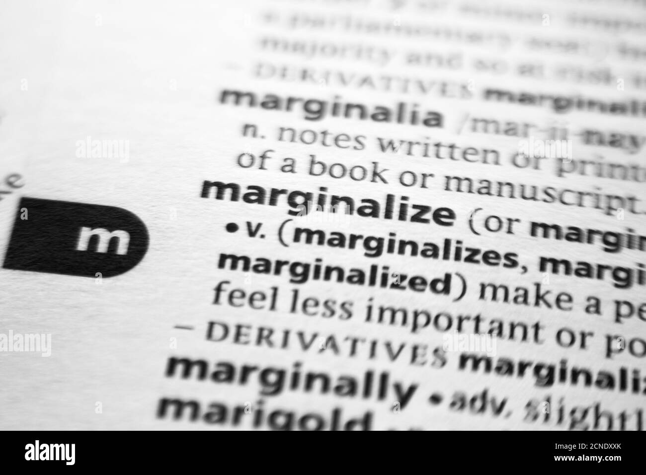 Word or phrase Marginalize in a dictionary Stock Photo - Alamy
