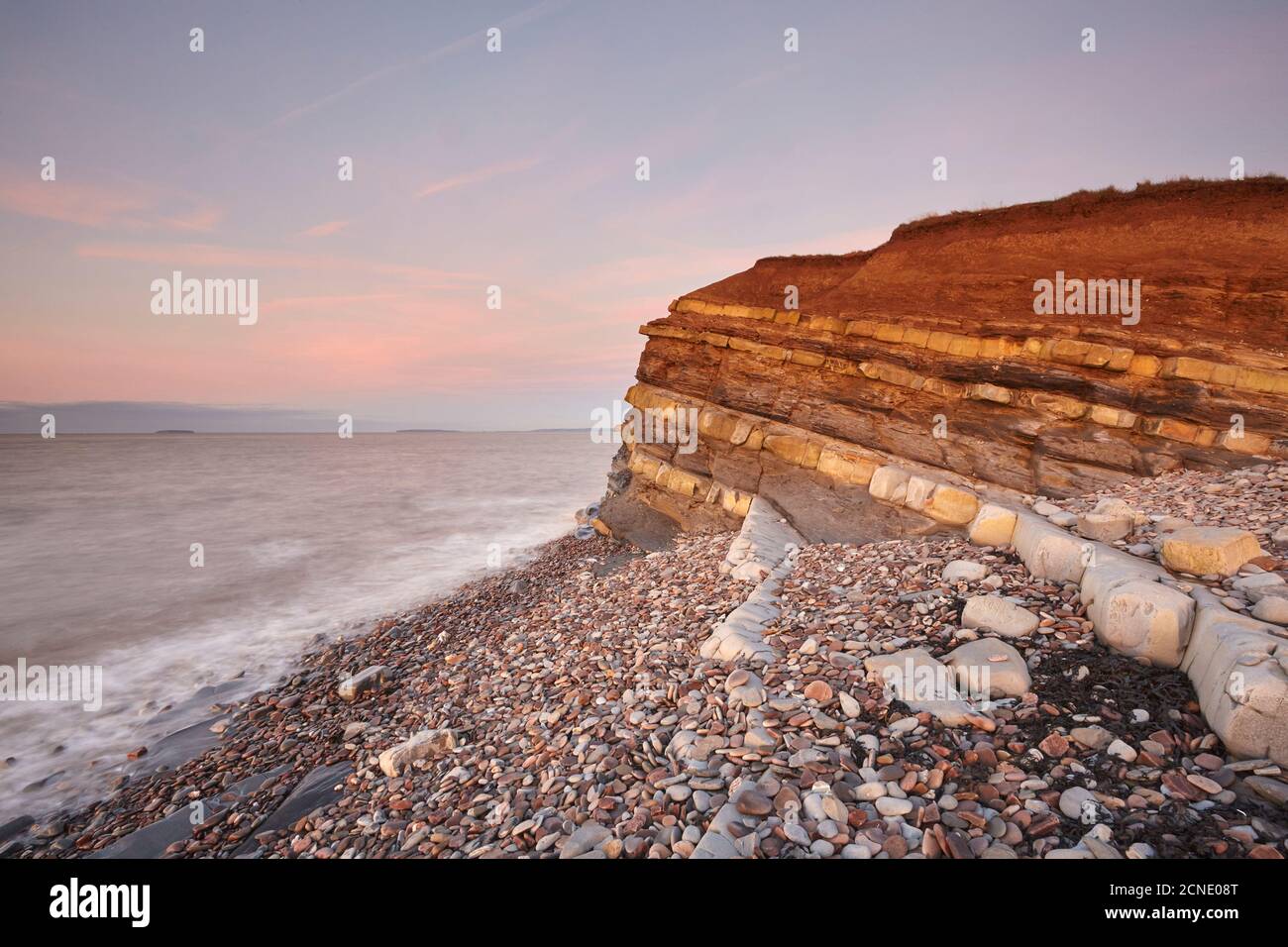 Evening light on rocks and the cliff at Kilve beach, Kilve, near Nether ...