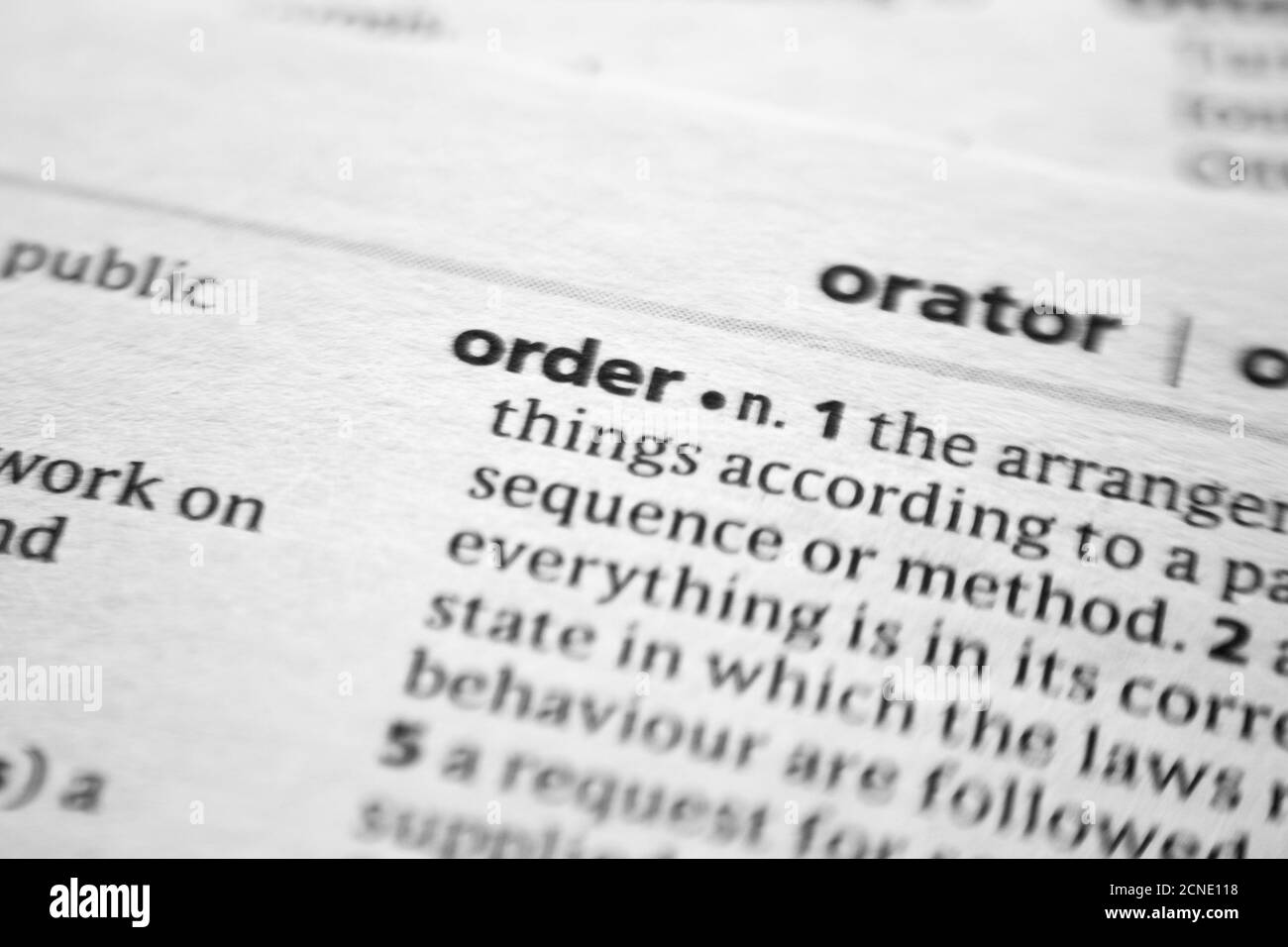 Magnifying glass on dictionary page Black and White Stock Photos ...