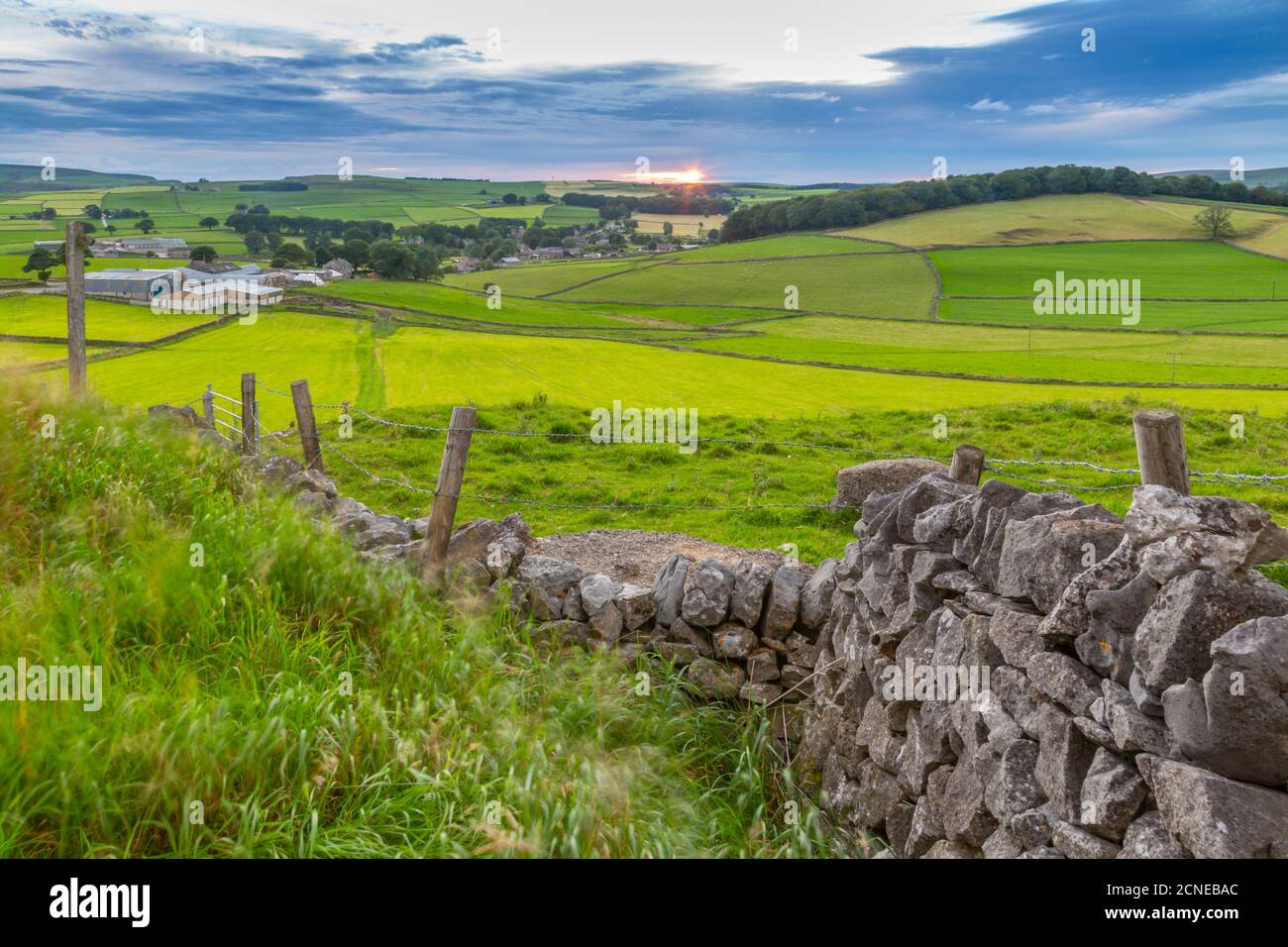 View of sunset and dry stone wall overlooking Peak Forest, Peak ...