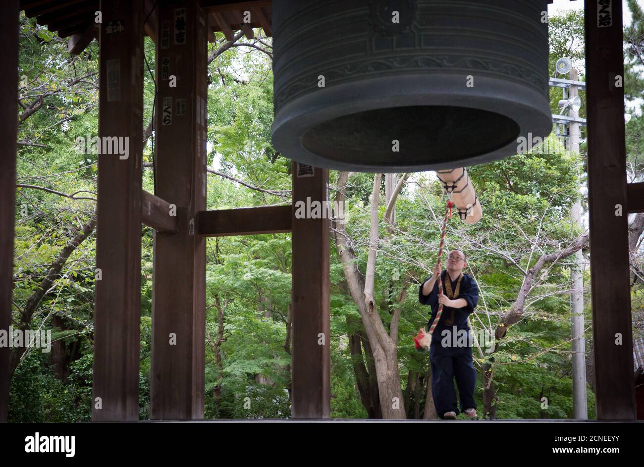 Tokyo, Japan. 17th Sep, 2020. A buddhist monk rings a Bonsho bell also ...