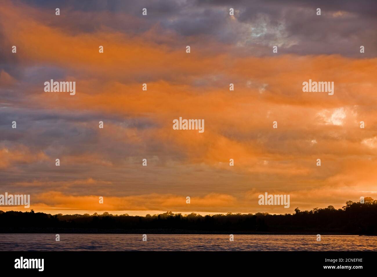 Sunset on Madre de Dios River, Manu national Park in Peru Stock Photo ...