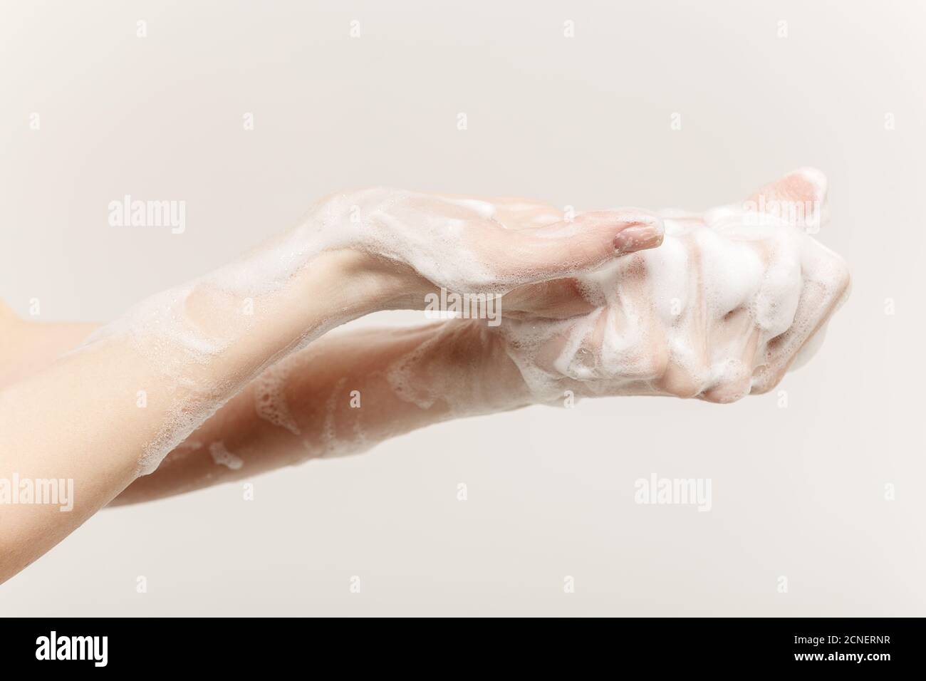 Washing arms with soap hi-res stock photography and images - Alamy