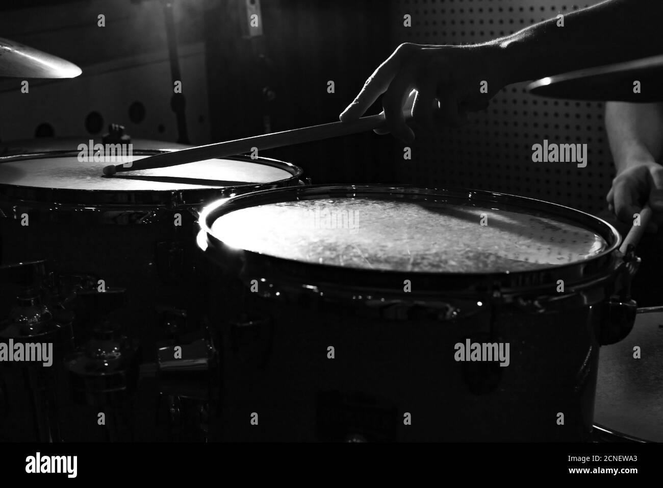 Drummer beats drums with drumsticks, close-up photo Stock Photo - Alamy