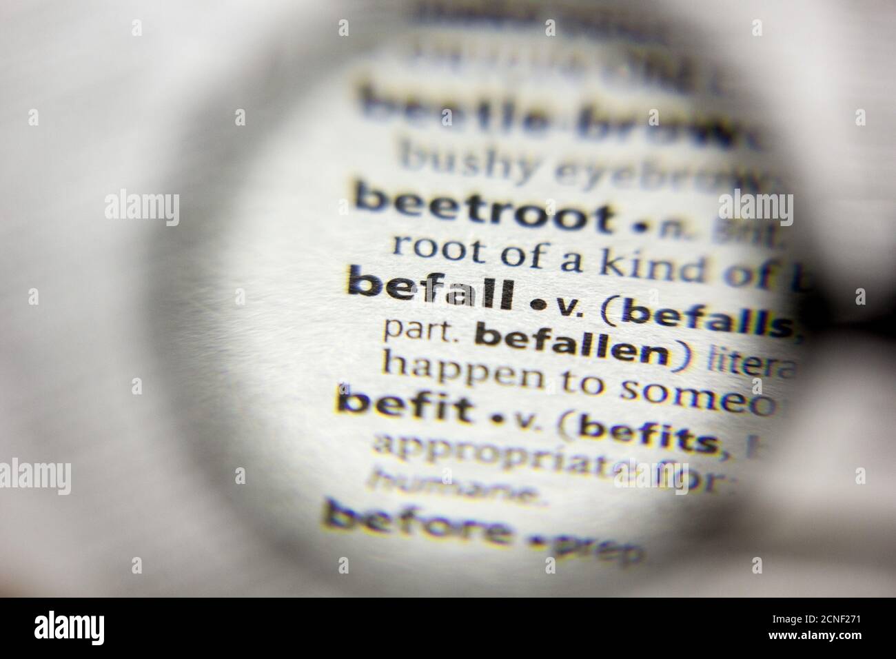 The word or phrase Befall in a dictionary Stock Photo - Alamy
