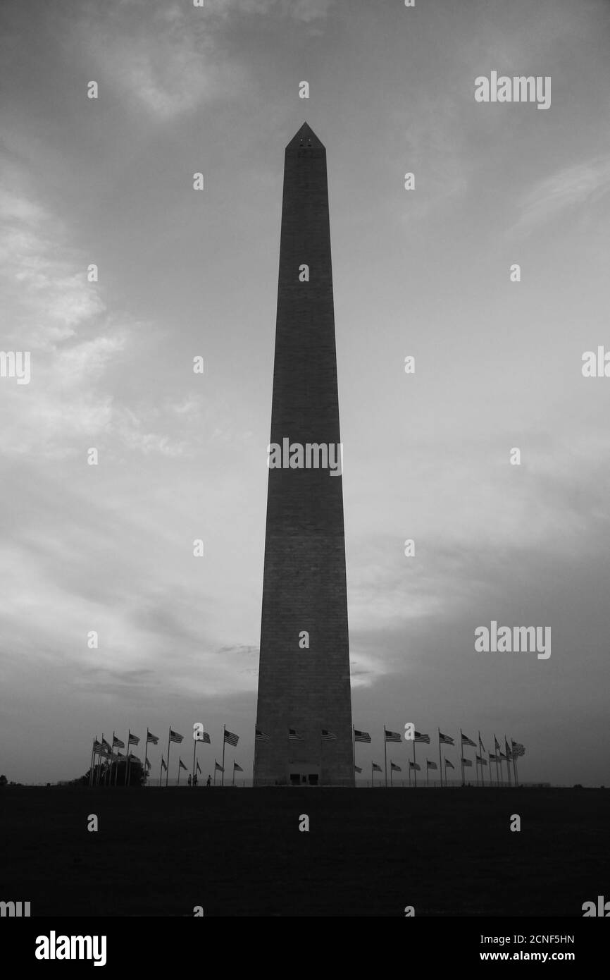 Moody sunset behind a silhouetted Washington Monument in Washington DC ...
