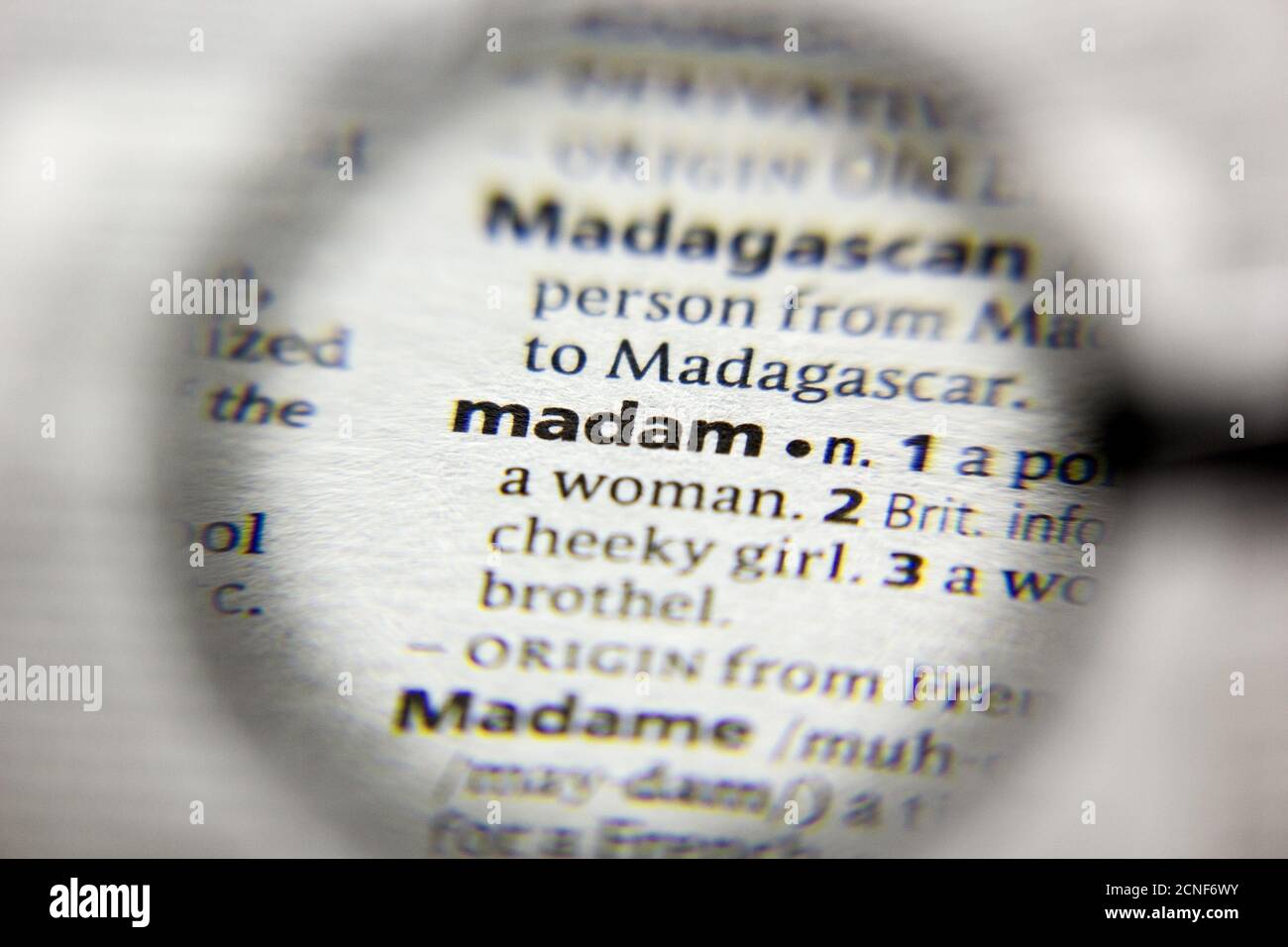 The word or phrase Madam in a dictionary Stock Photo - Alamy