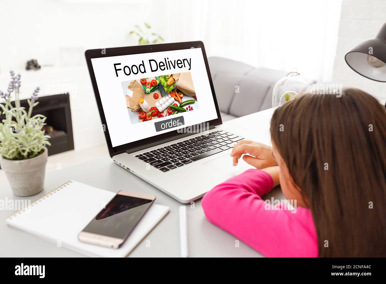 Food take away website in a laptop screen. Lunch at the office Stock ...