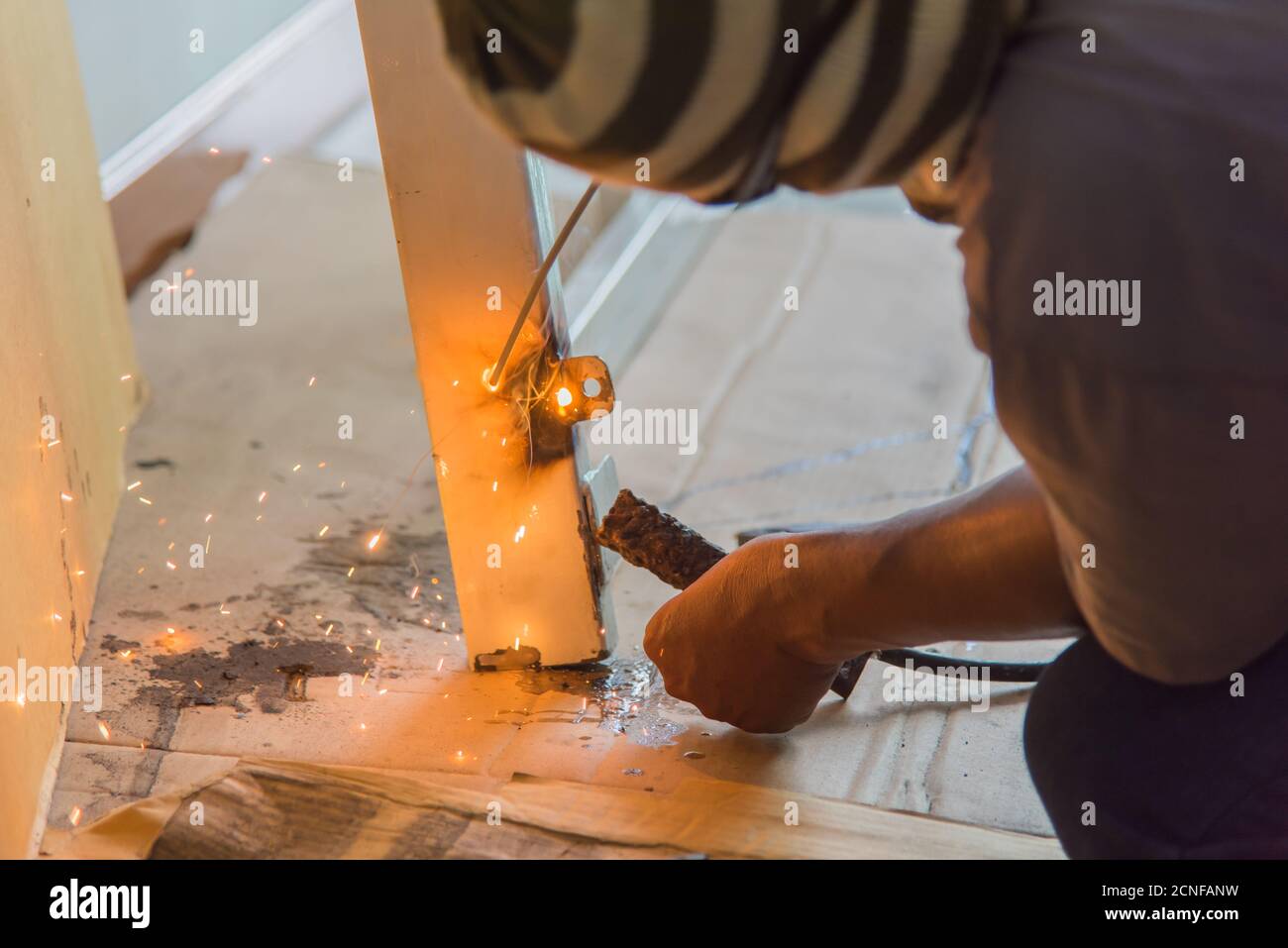 Industrial metal welding worker with many sharp spark Stock Photo - Alamy