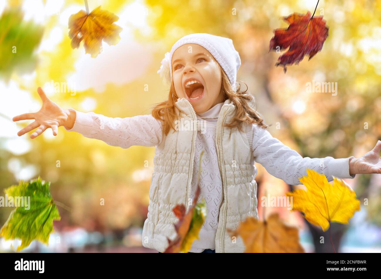 Happy child having fun in park Stock Photo - Alamy