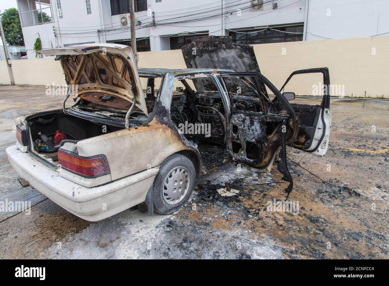 Burned and damaged car engine after fire accident Stock Photo - Alamy
