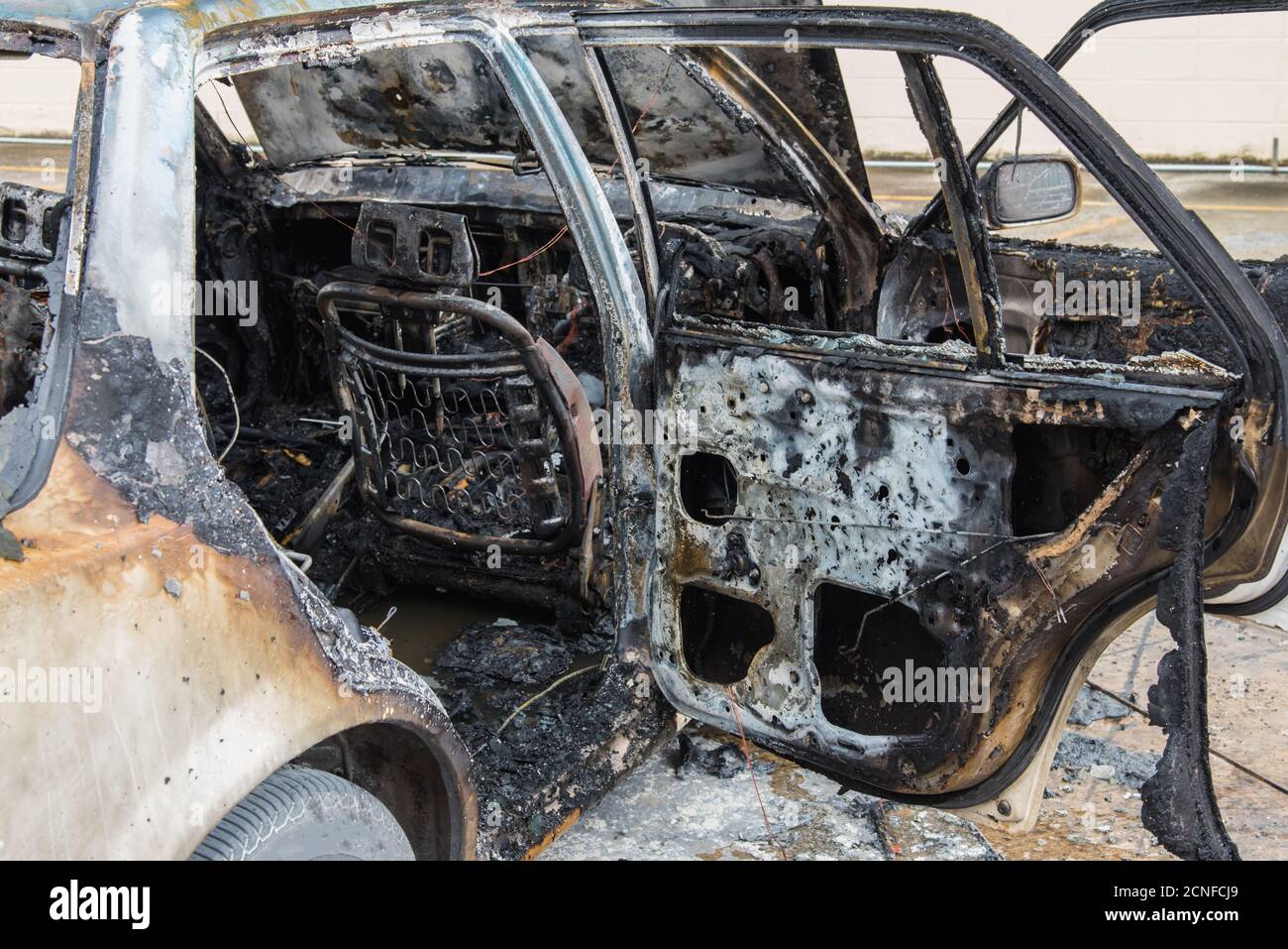 Burned and damaged old car engine after fire accident Stock Photo - Alamy