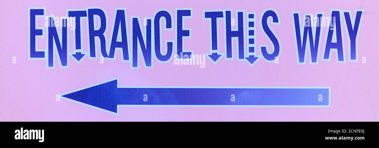 entrance this way sign Stock Photo - Alamy