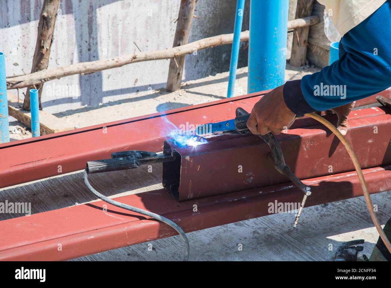 Welder worker welding metal by electrode in construction site Stock ...