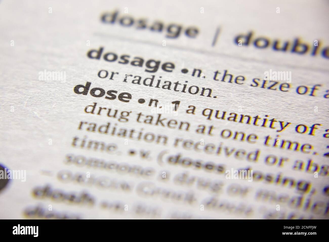Word or phrase Dose in a dictionary Stock Photo - Alamy
